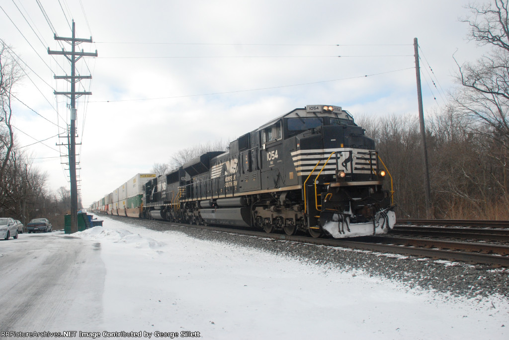 NS 1054 takes more doublestacks east.